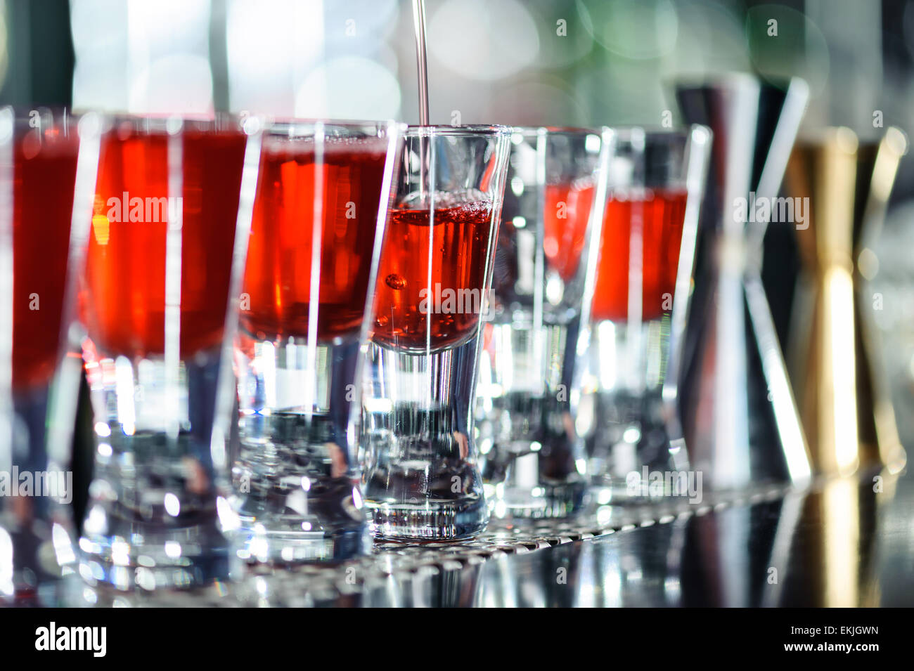 Barman makes shots in a bar Stock Photo - Alamy