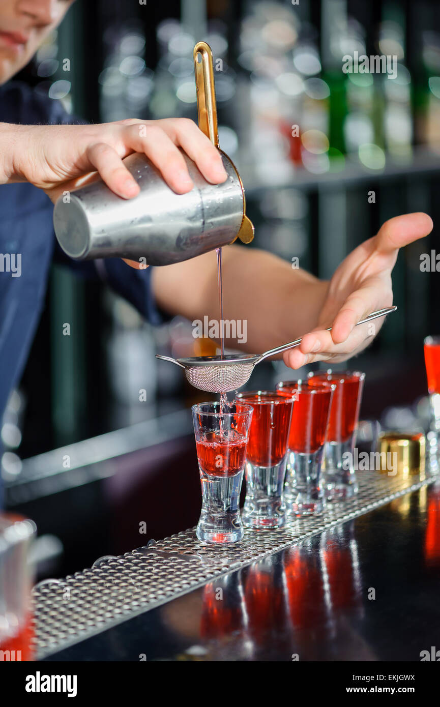 Barman makes shots in a bar Stock Photo - Alamy