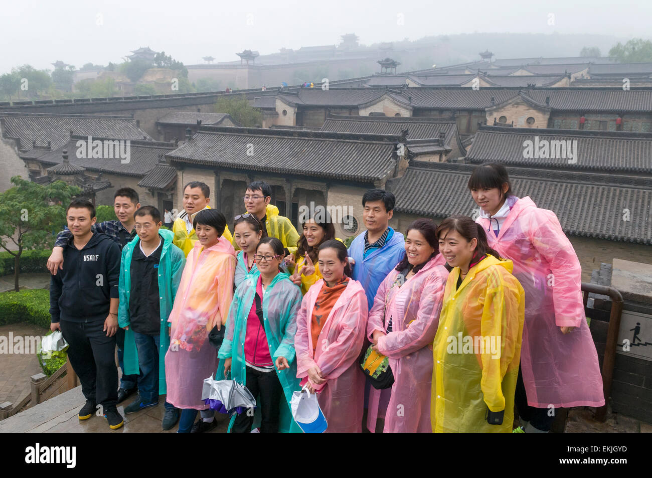 Chinese tourists brave rain at the Wang Family Courtyard Home, Linshi ...