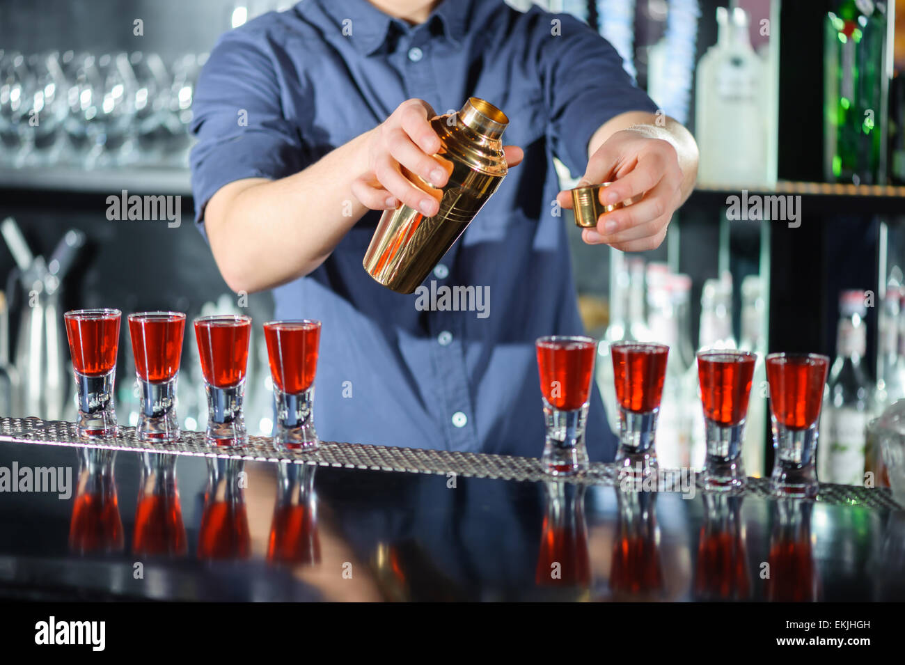 Barman makes shots in a bar Stock Photo - Alamy