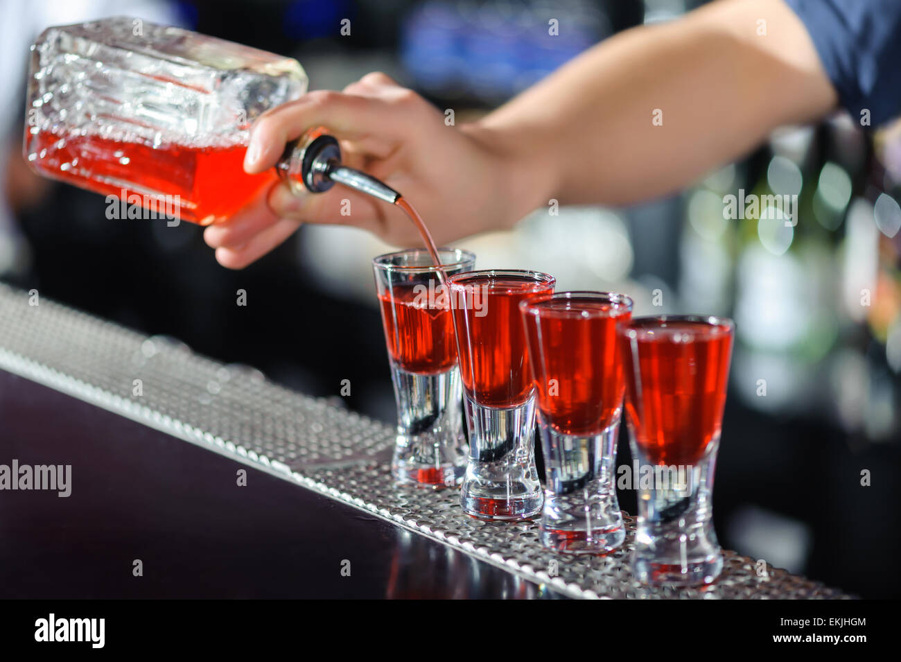 Barman makes shots in a bar Stock Photo - Alamy