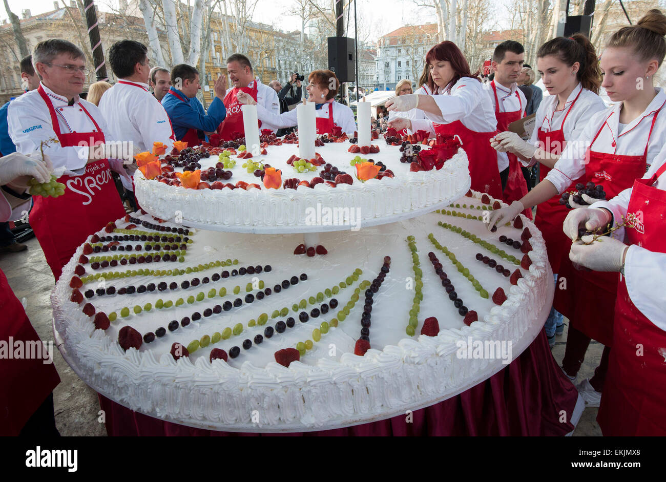 Zagreb, Croatia. 10th Apr, 2015. Chefs decorate a large cake during the ...