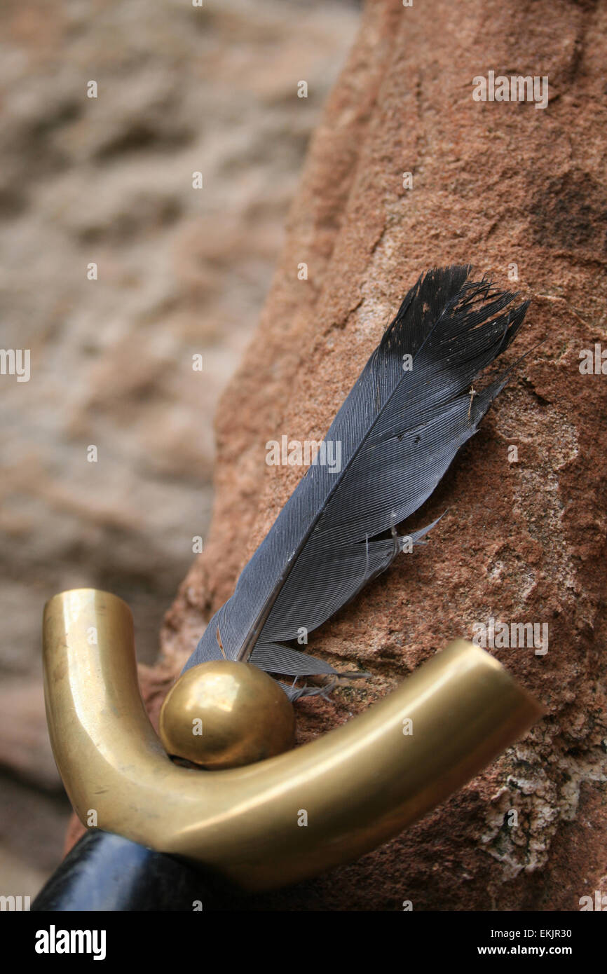 Feather and sword Stock Photo - Alamy