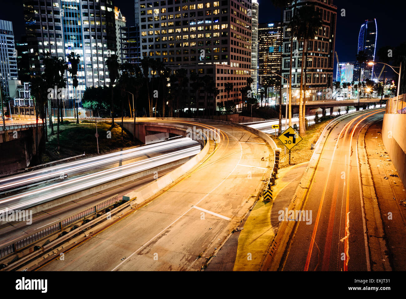 Traffic on the 110 Freeway and buildings in Los Angeles at night, seen ...