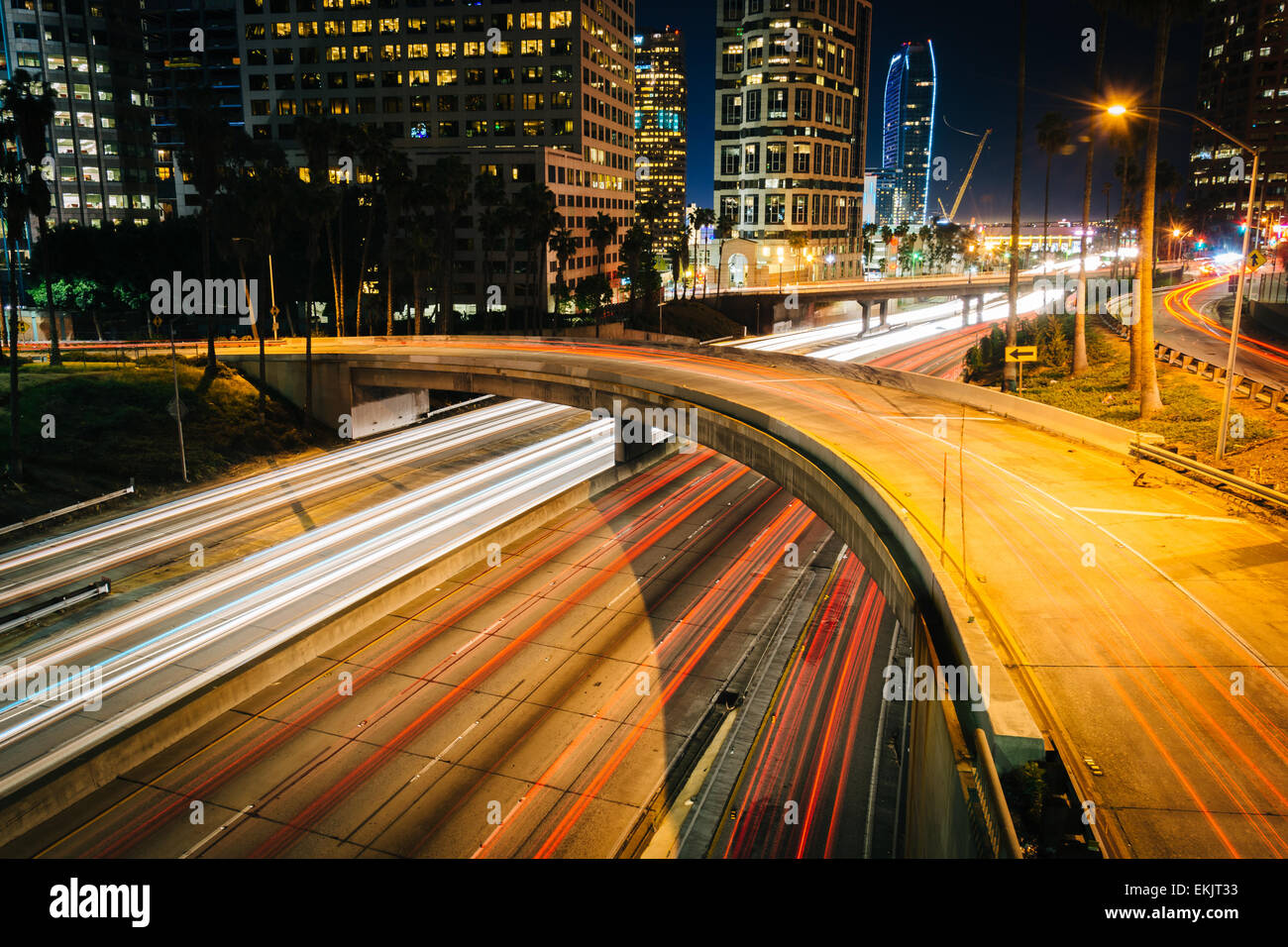 Traffic on the 110 Freeway and buildings in Los Angeles at night, seen ...