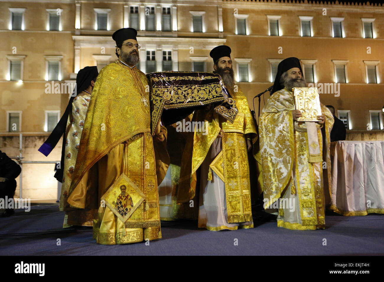 Athens, Greece. 10th Apr, 2015. Greek Orthodox priests carry the ...