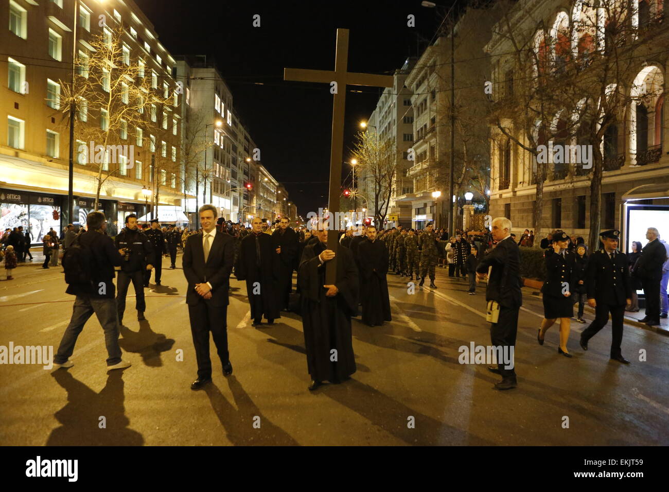 Athens, Greece. 10th Apr, 2015. A large cross is carried on the head of ...