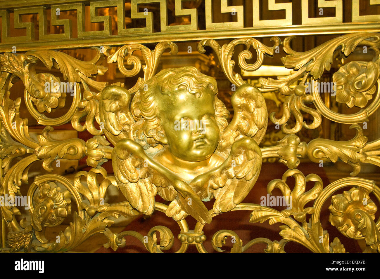 Openwork grille with gilded angel Stock Photo - Alamy