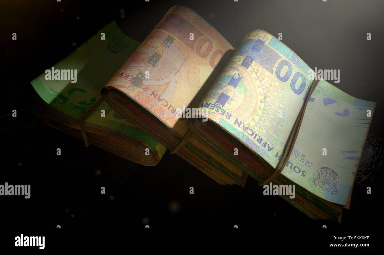 A close-up view of three wads of folded over stacks of south african ...