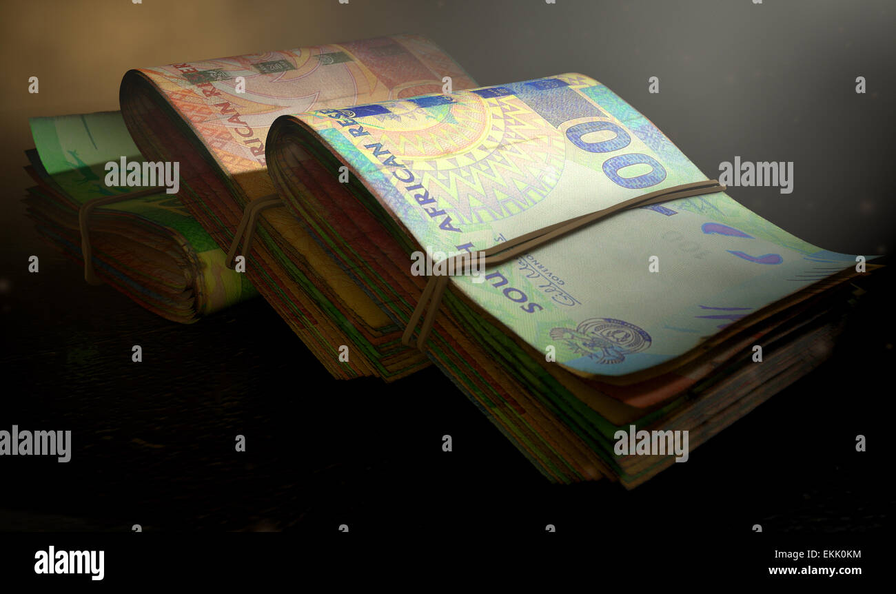 A close-up view of three wads of folded over stacks of south african ...