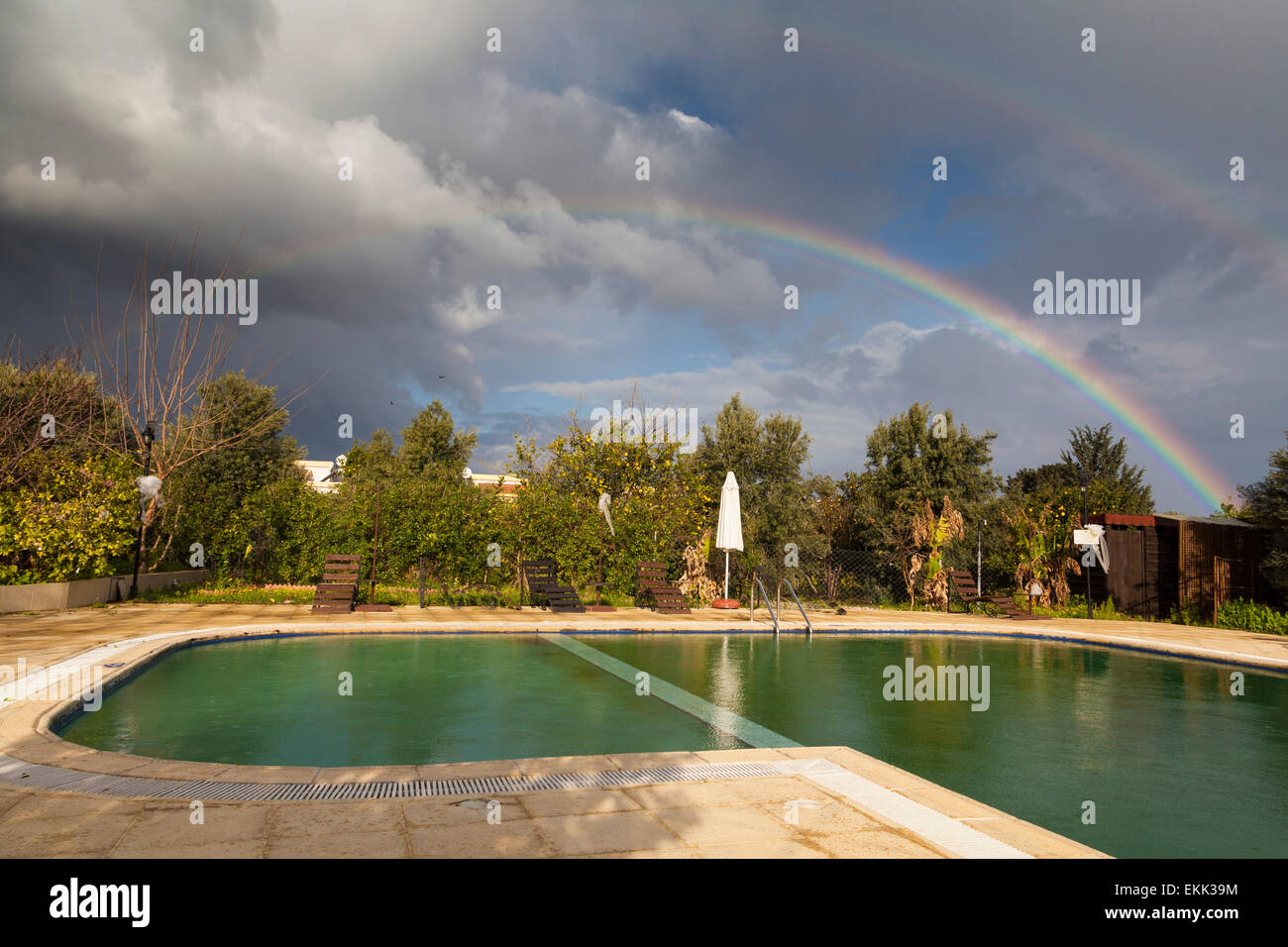 Swimming pool with rainbow Stock Photo - Alamy