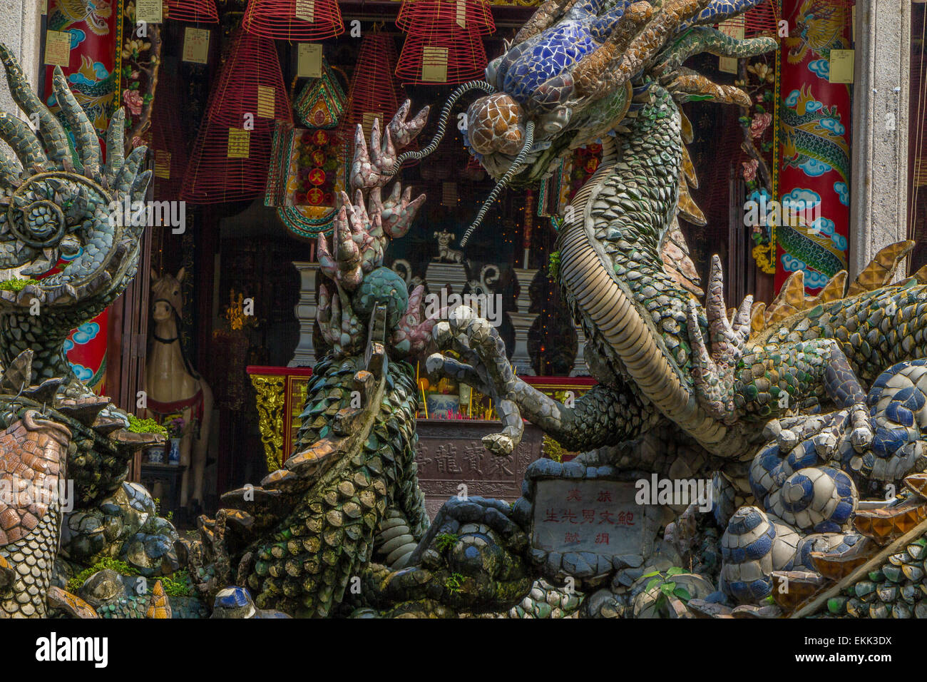 Mosaic sculpture of a dragon inside a Buddhist temple in the centre of ...