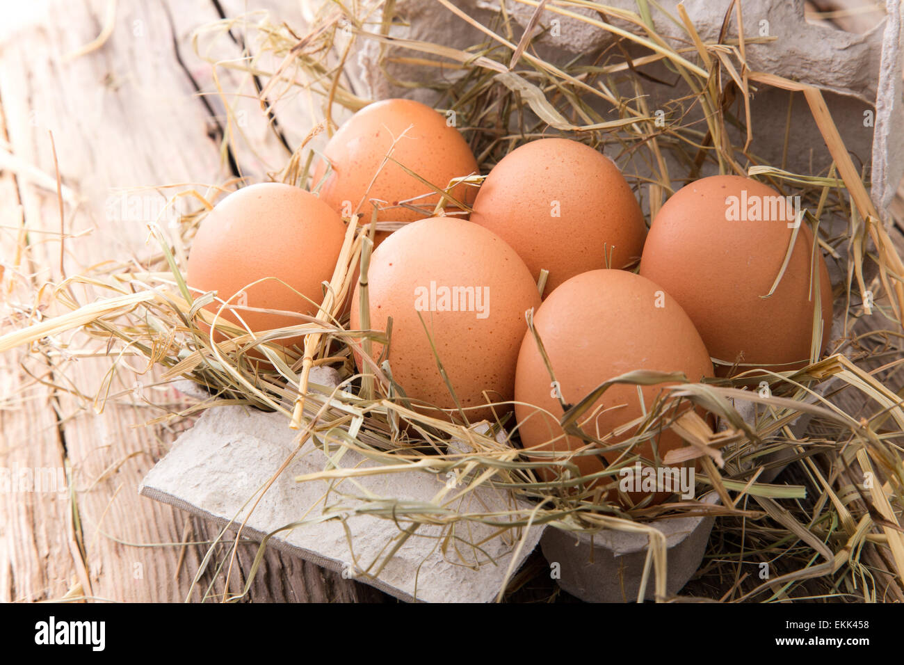 eggs in a box with hay Stock Photo - Alamy
