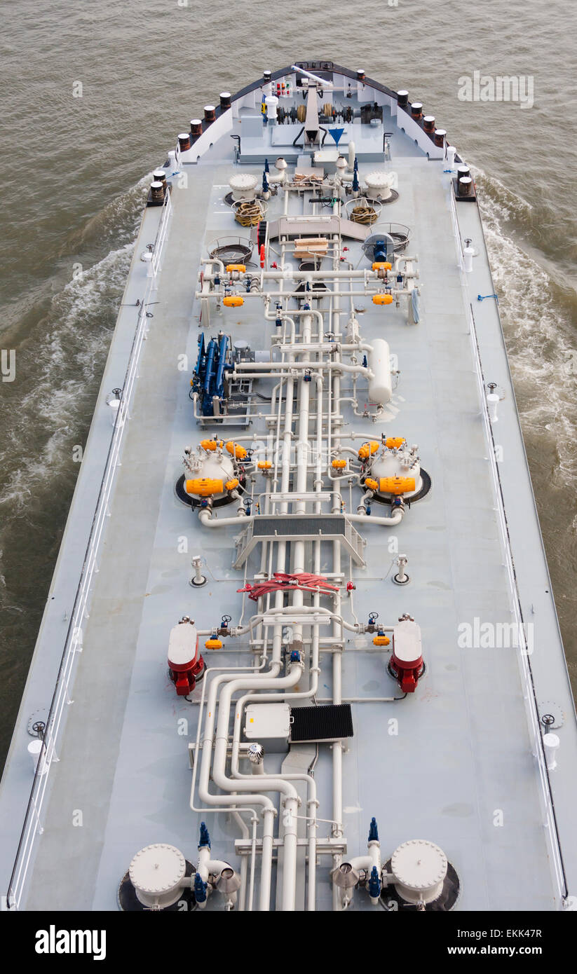 View from a bridge down to an oil or gas tanker, a barge on the Rhine ...
