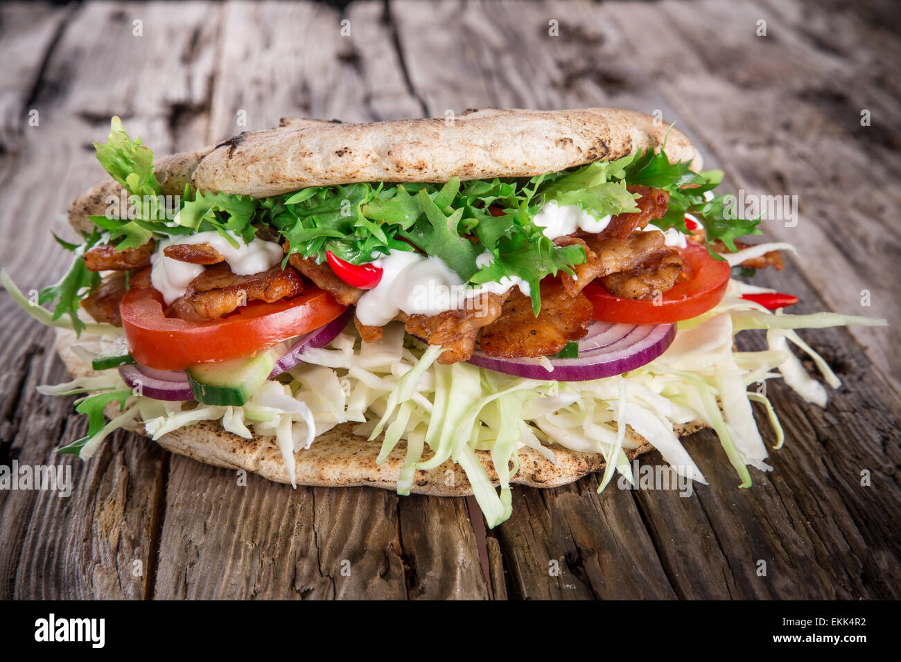 Doner Kebab - grilled meat, bread and vegetables Stock Photo - Alamy