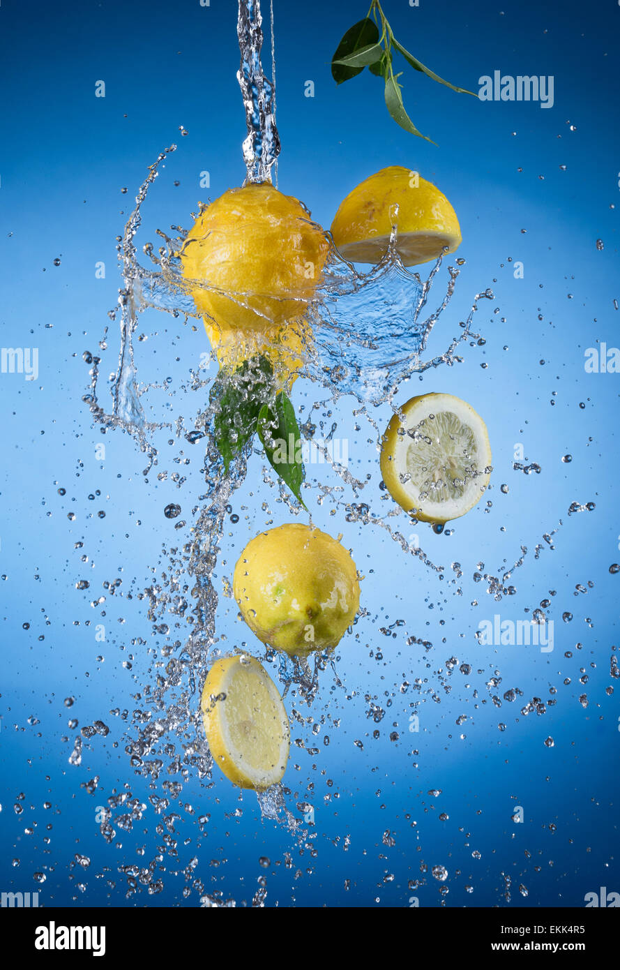 Lemon with water splash isolated on white Stock Photo - Alamy