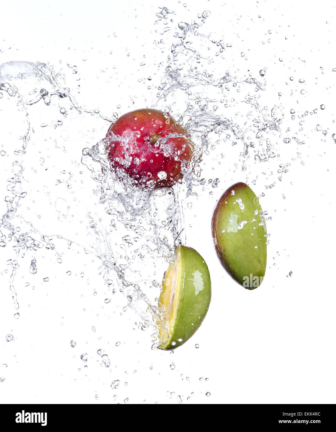 Mango with water splash isolated on white Stock Photo - Alamy