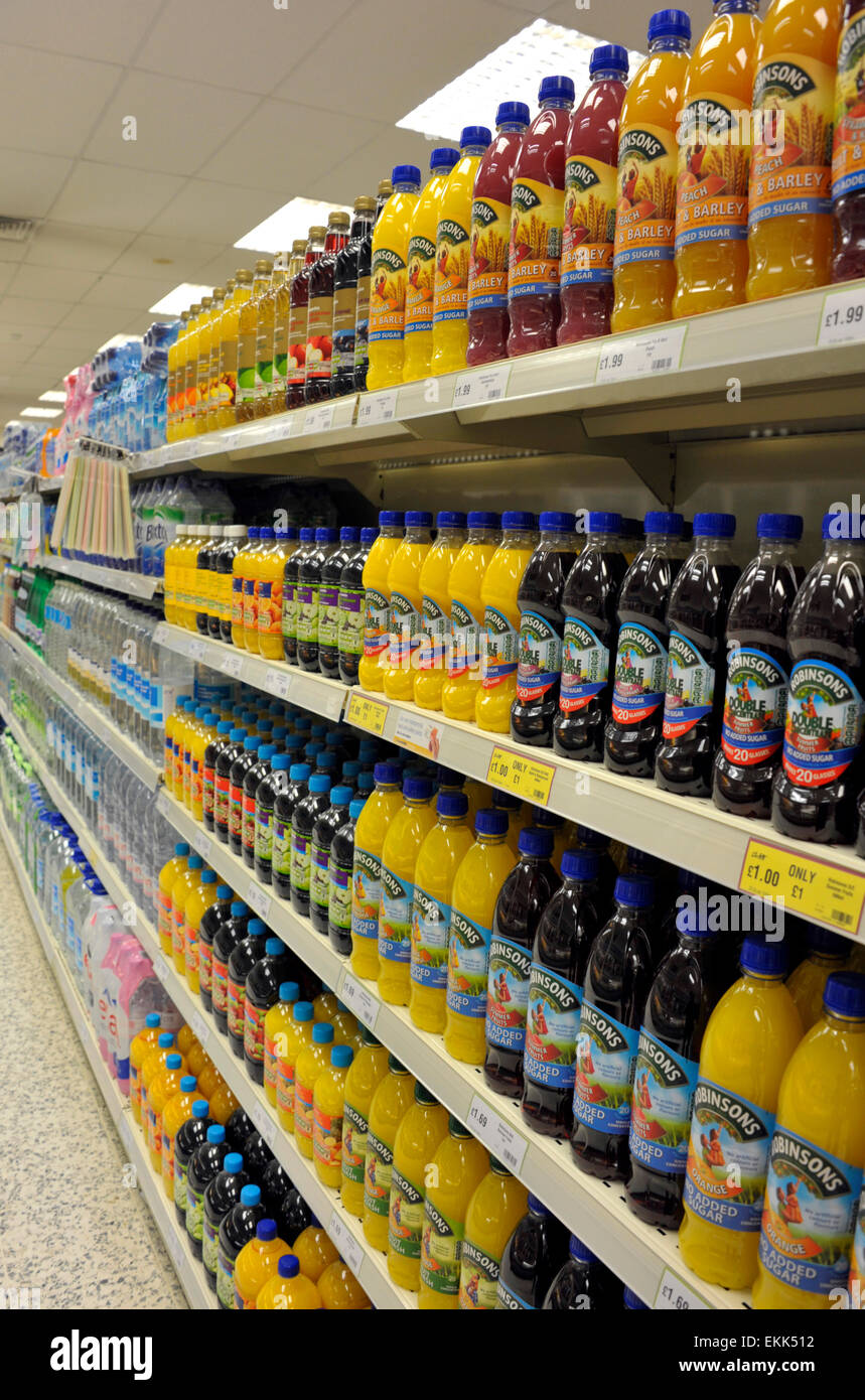 Plastic soft drinks bottles on a supermarket shelf display Stock Photo ...