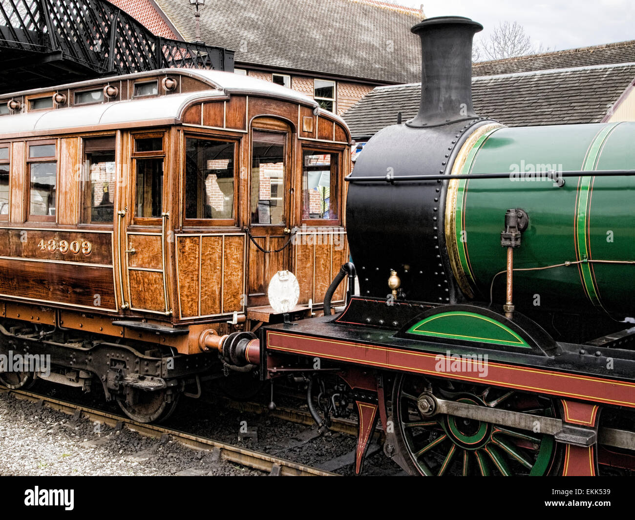Green steam locomotive and carriage Stock Photo - Alamy