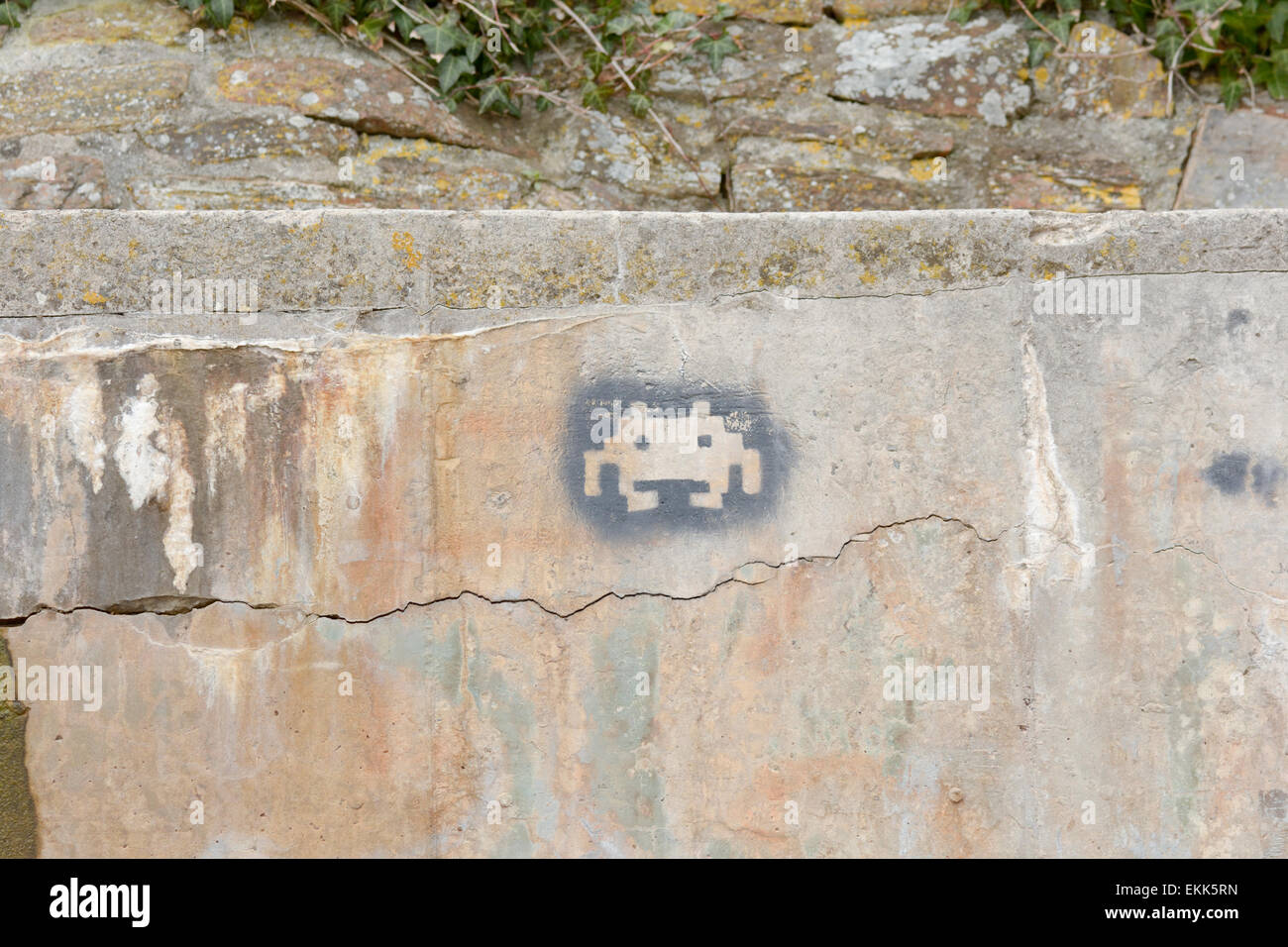 Space Invader stencil graffiti on wall Stock Photo - Alamy