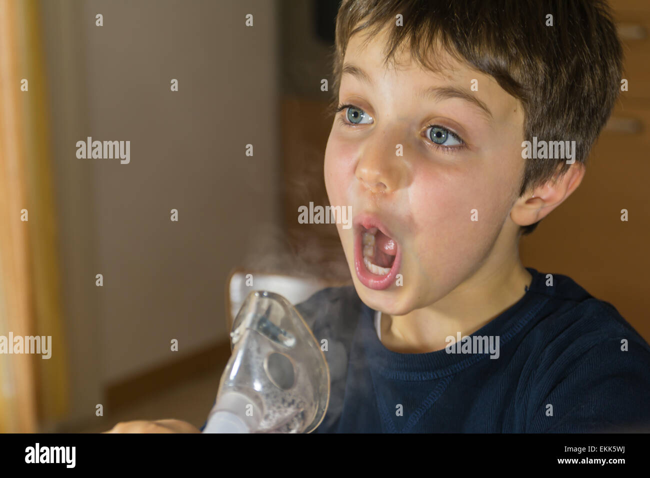 child taking respiratory, inhalation therapy Stock Photo - Alamy