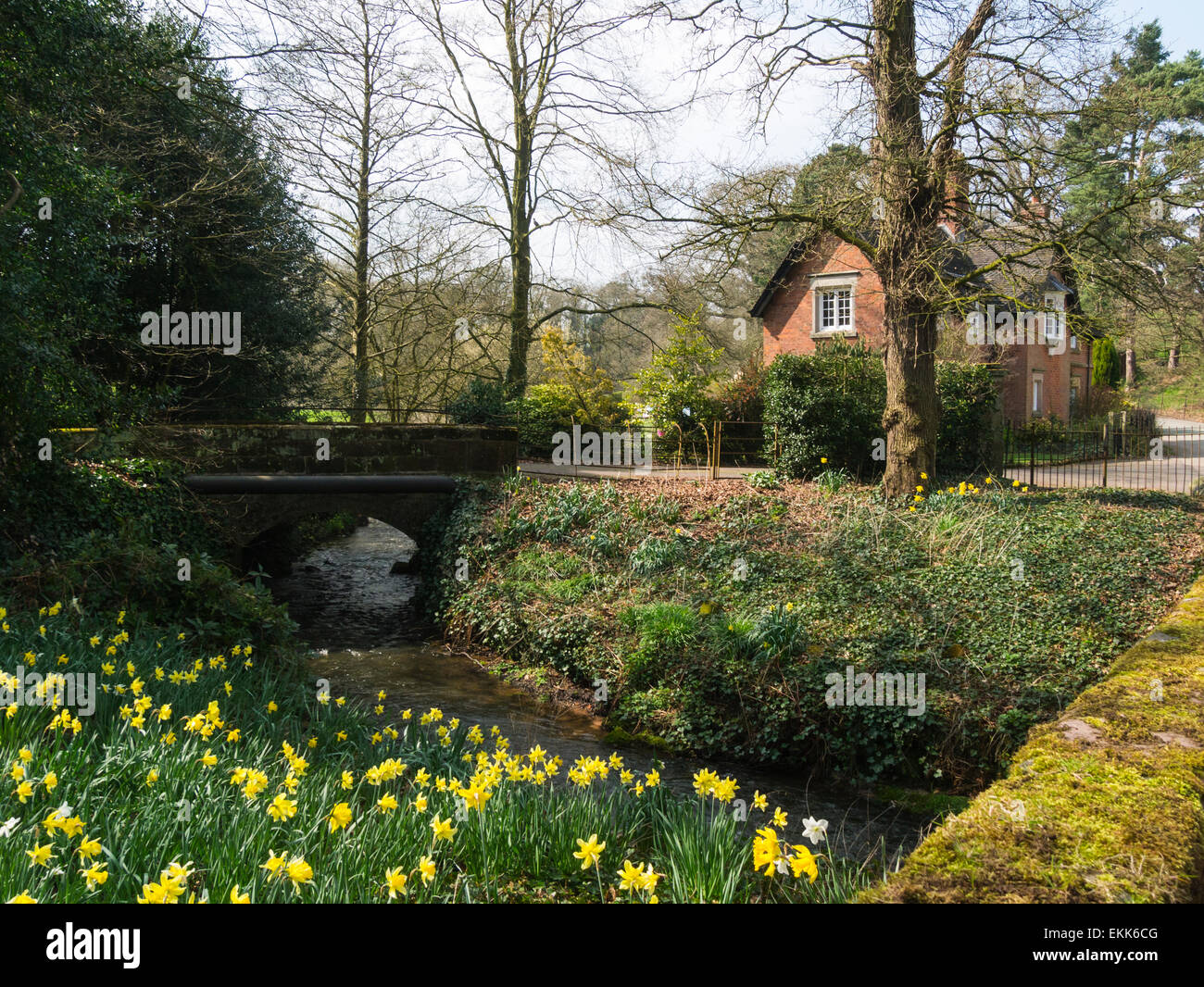 Lovely red brick country house in Shropshire side of stream with road ...