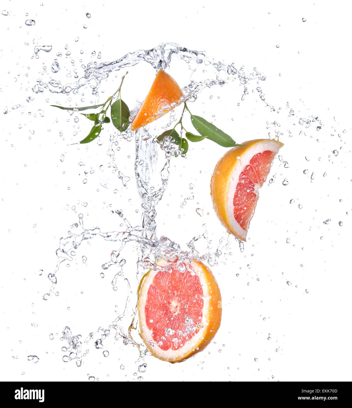Grapefruit with water splash isolated on white Stock Photo - Alamy