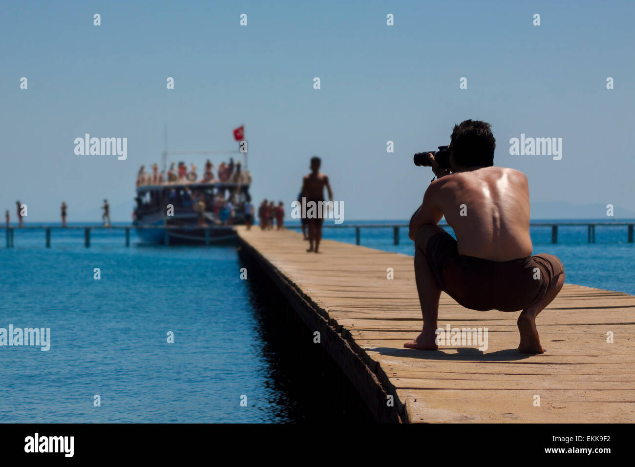As passengers disembark from a cruise ship a photographer captures the ...