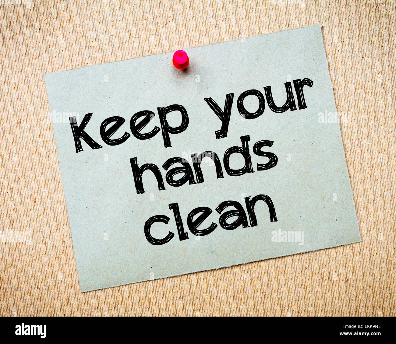 Keep Your Hands Clean Message. Recycled paper note pinned on cork board ...