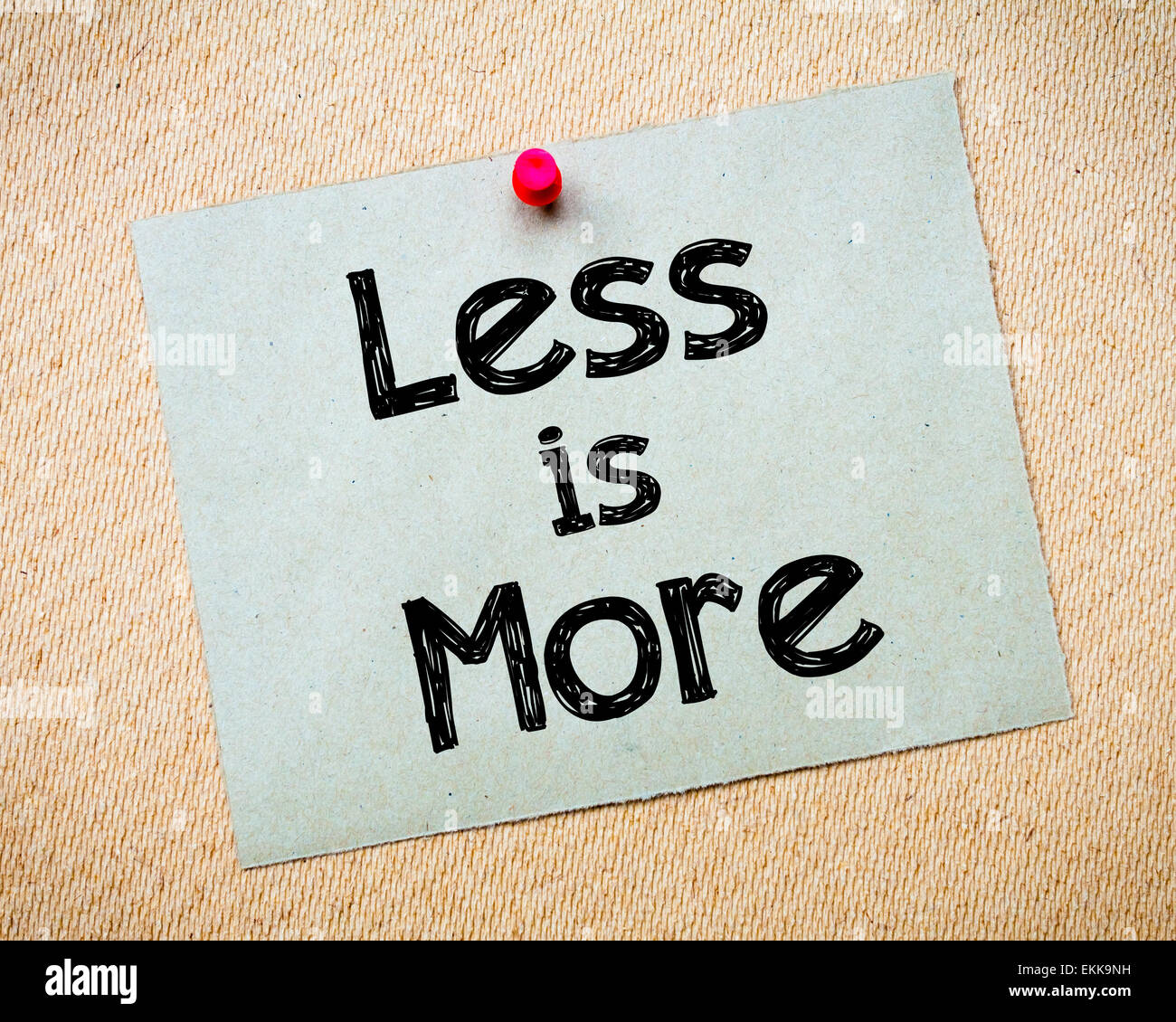 Less is More Message. Recycled paper note pinned on cork board. Concept ...