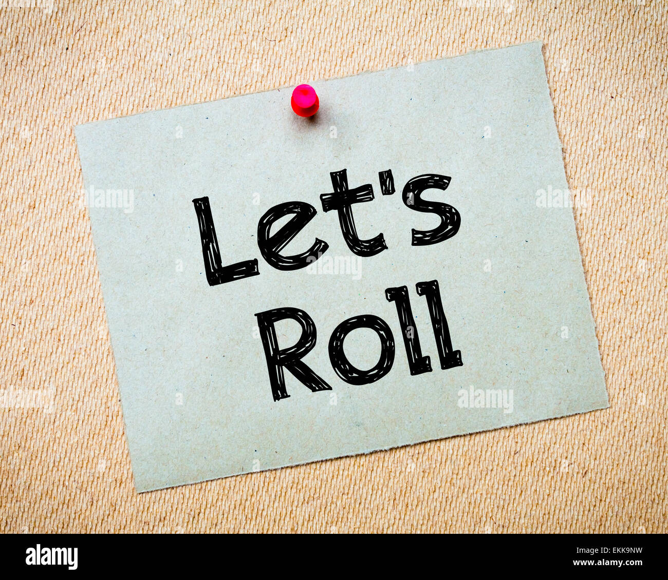 Let's Roll Message. Recycled paper note pinned on cork board. Concept ...