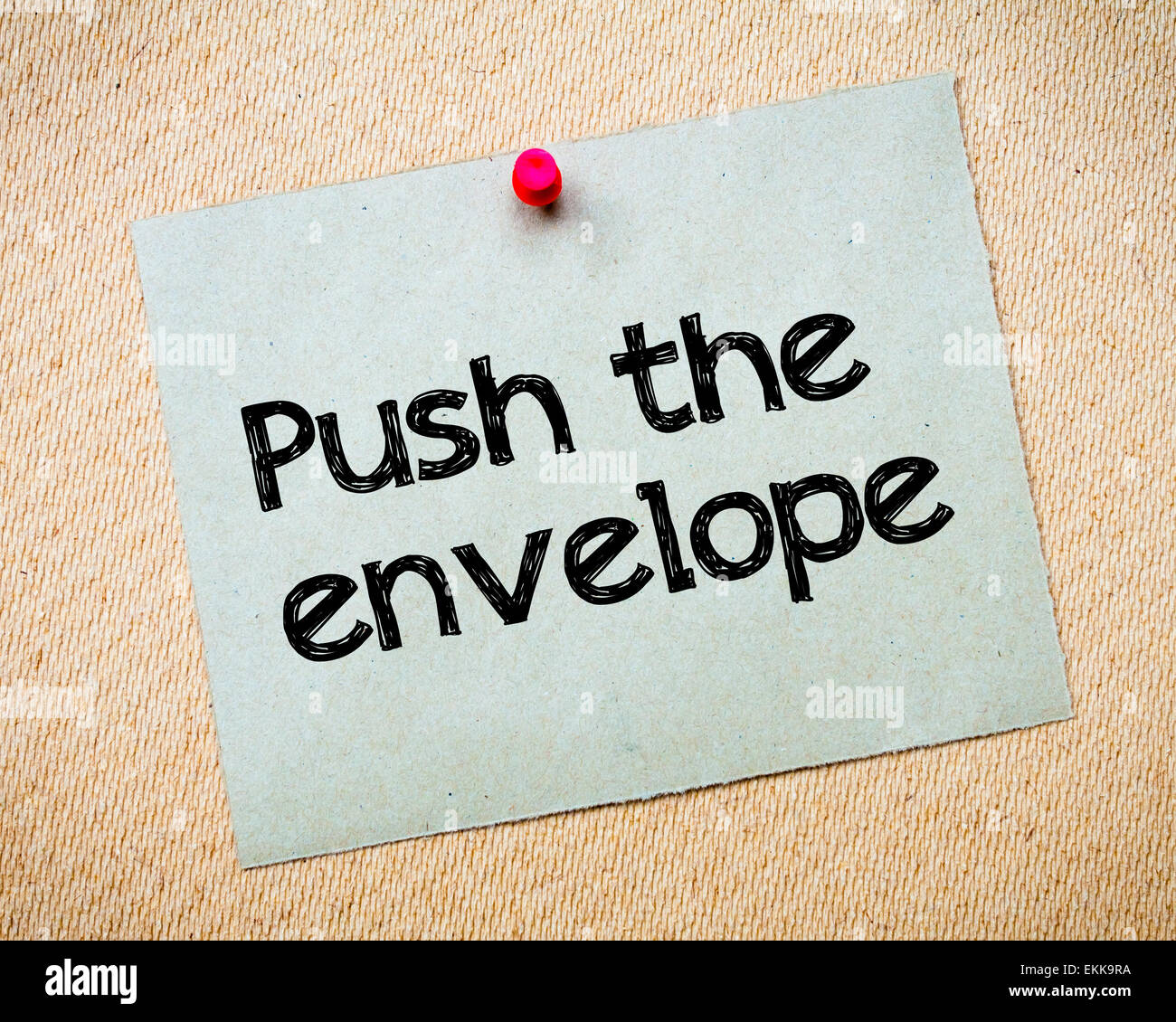 Push The Envelope Message. Recycled paper note pinned on cork board ...