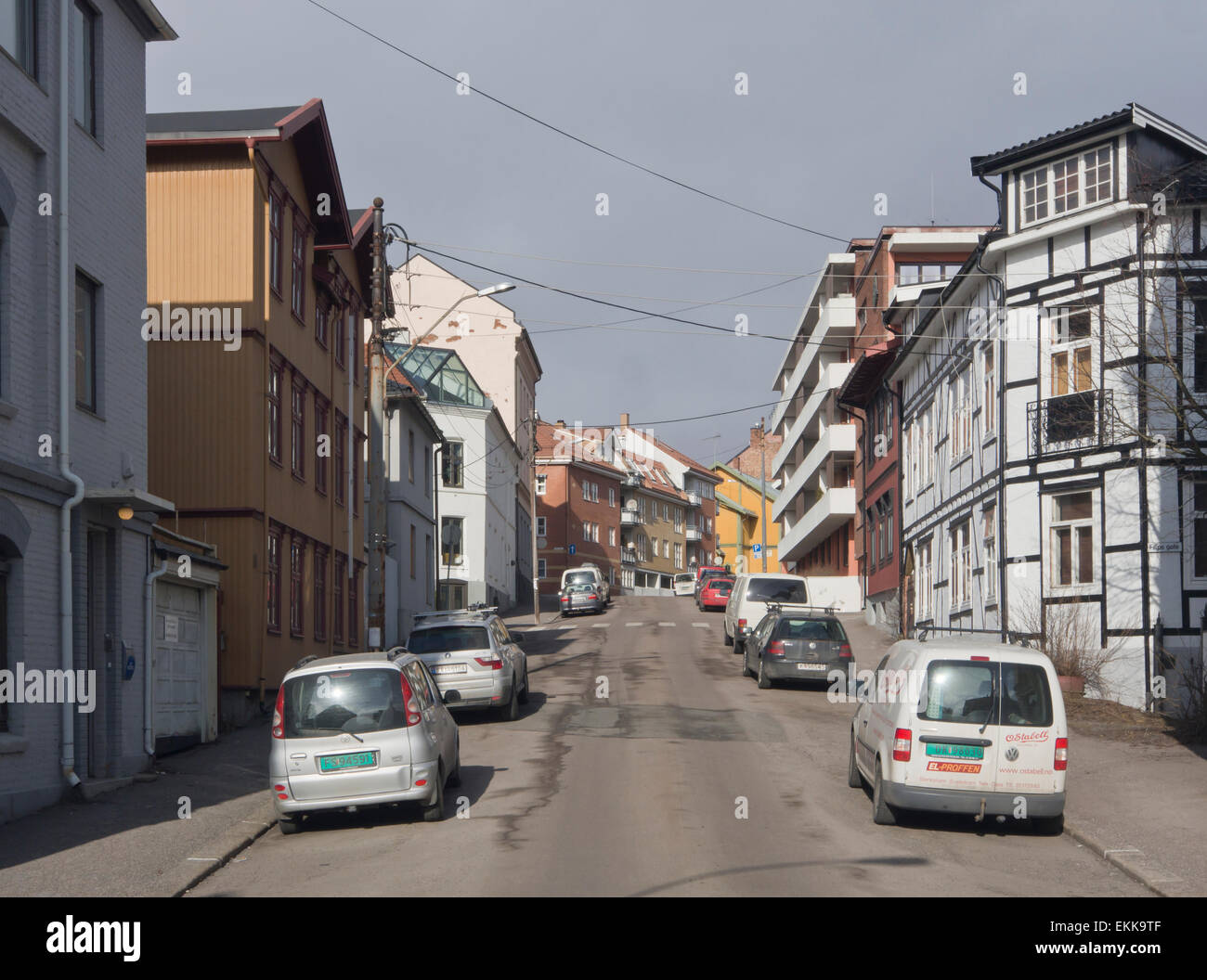 Street in the Kampen district of Oslo Norway, small wooden paneled ...