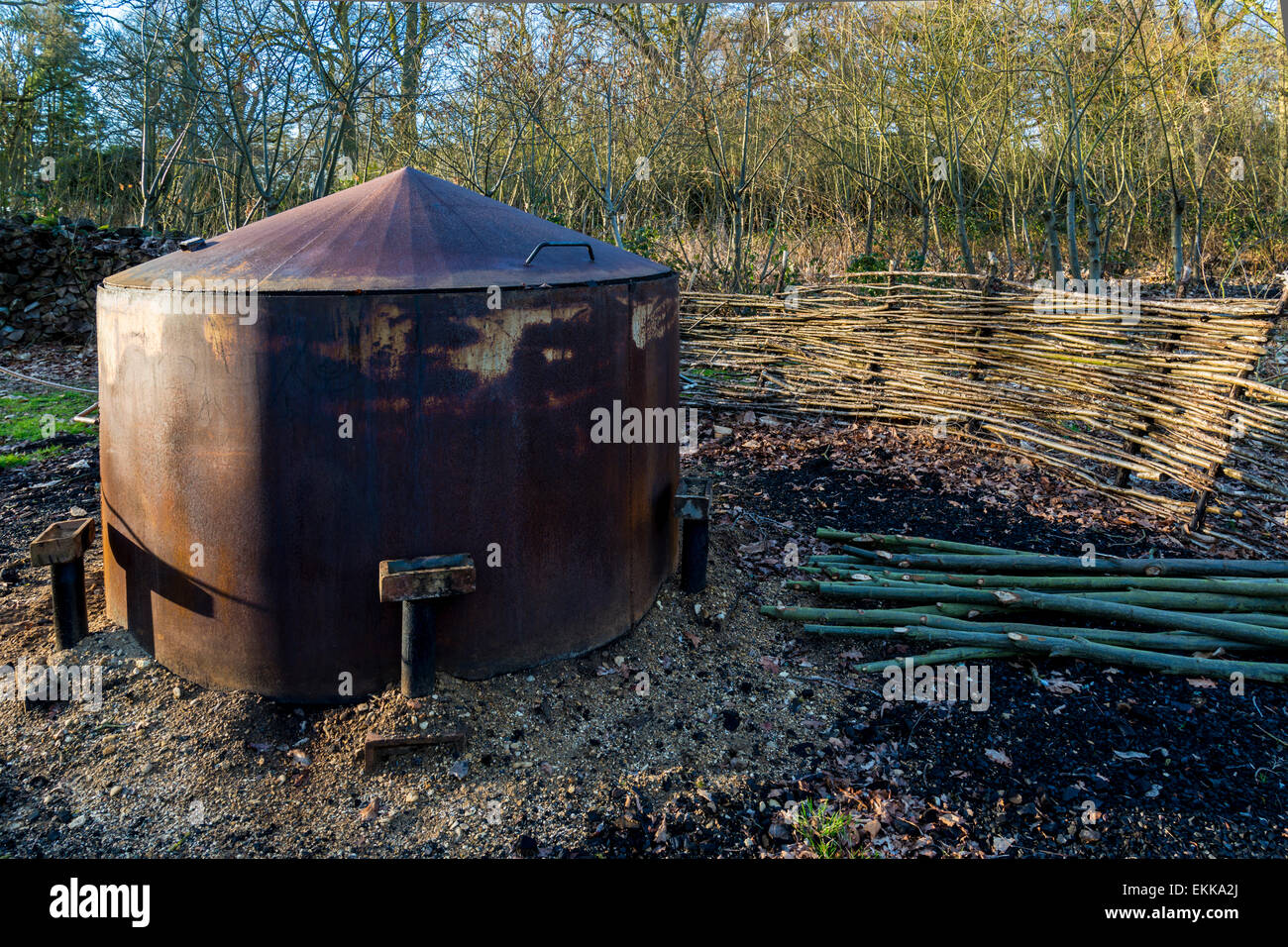 Ancient craft of creating charcoal using a slow furnace to burn wood ...