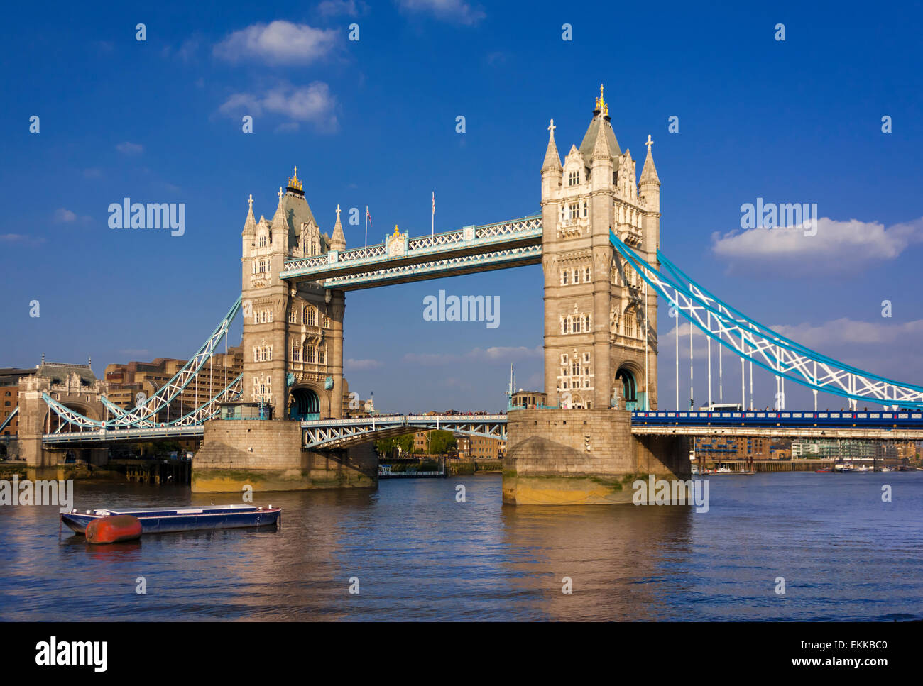 Calm waters of the River Thames flow beneath Tower Bridge Stock Photo ...