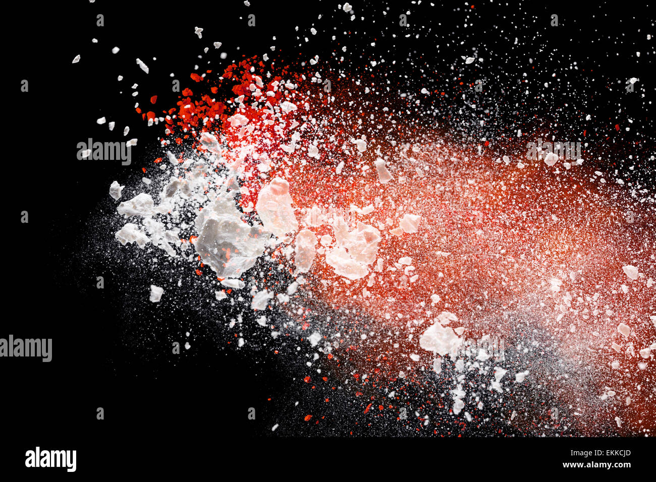 Launched colorful powder, isolated on black background Stock Photo - Alamy