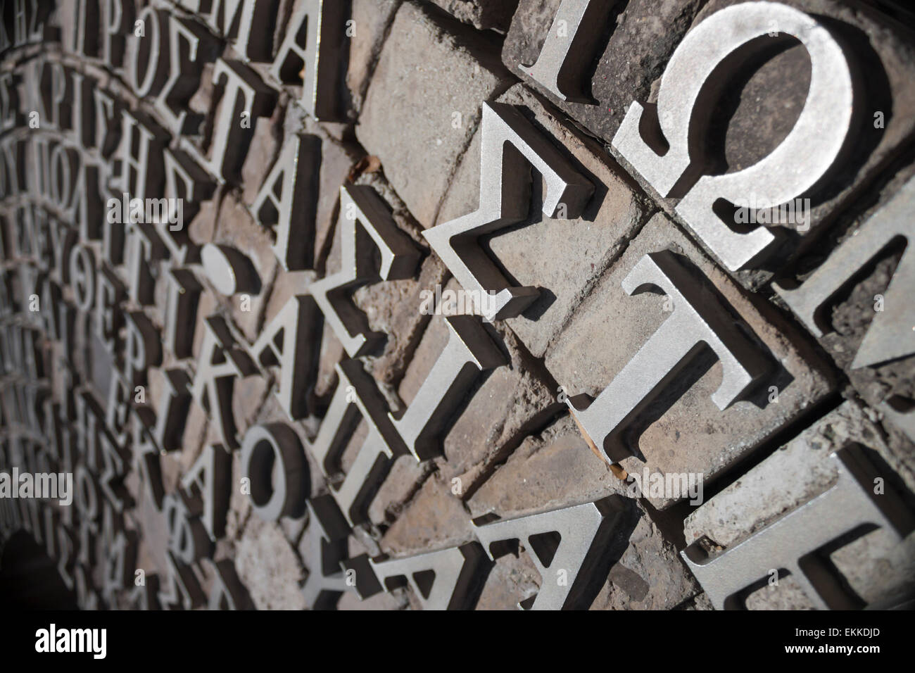 Metalic Greek lettering stands proud on a stone monument Stock Photo ...