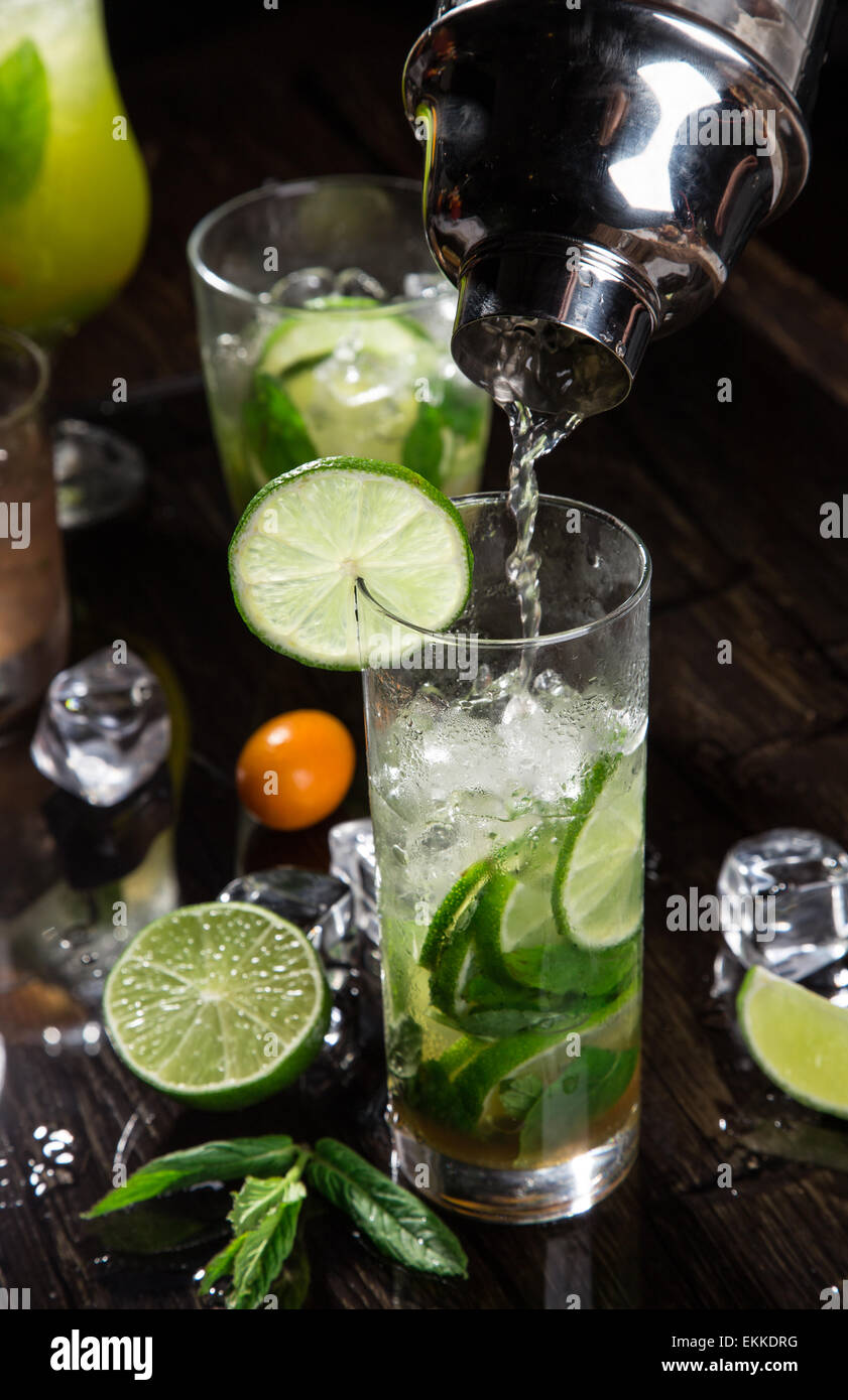 Pouring a cocktail into glass, close-up Stock Photo - Alamy