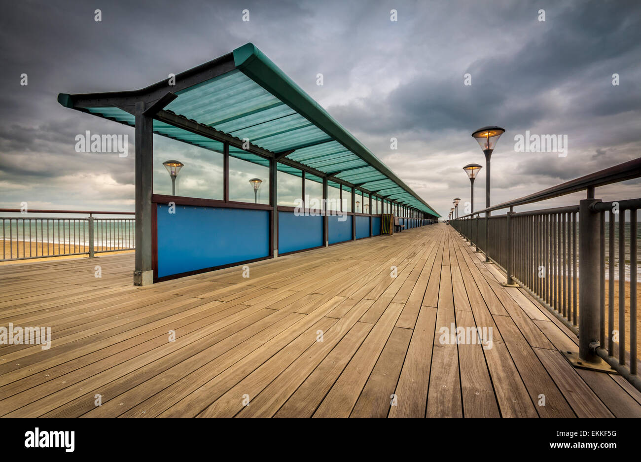 Boscombe Pier at sunset with brooding clouds Stock Photo - Alamy