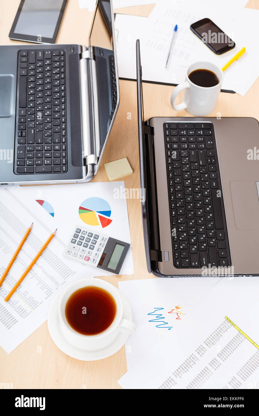 business workflow - above view of table with tools in modern office ...