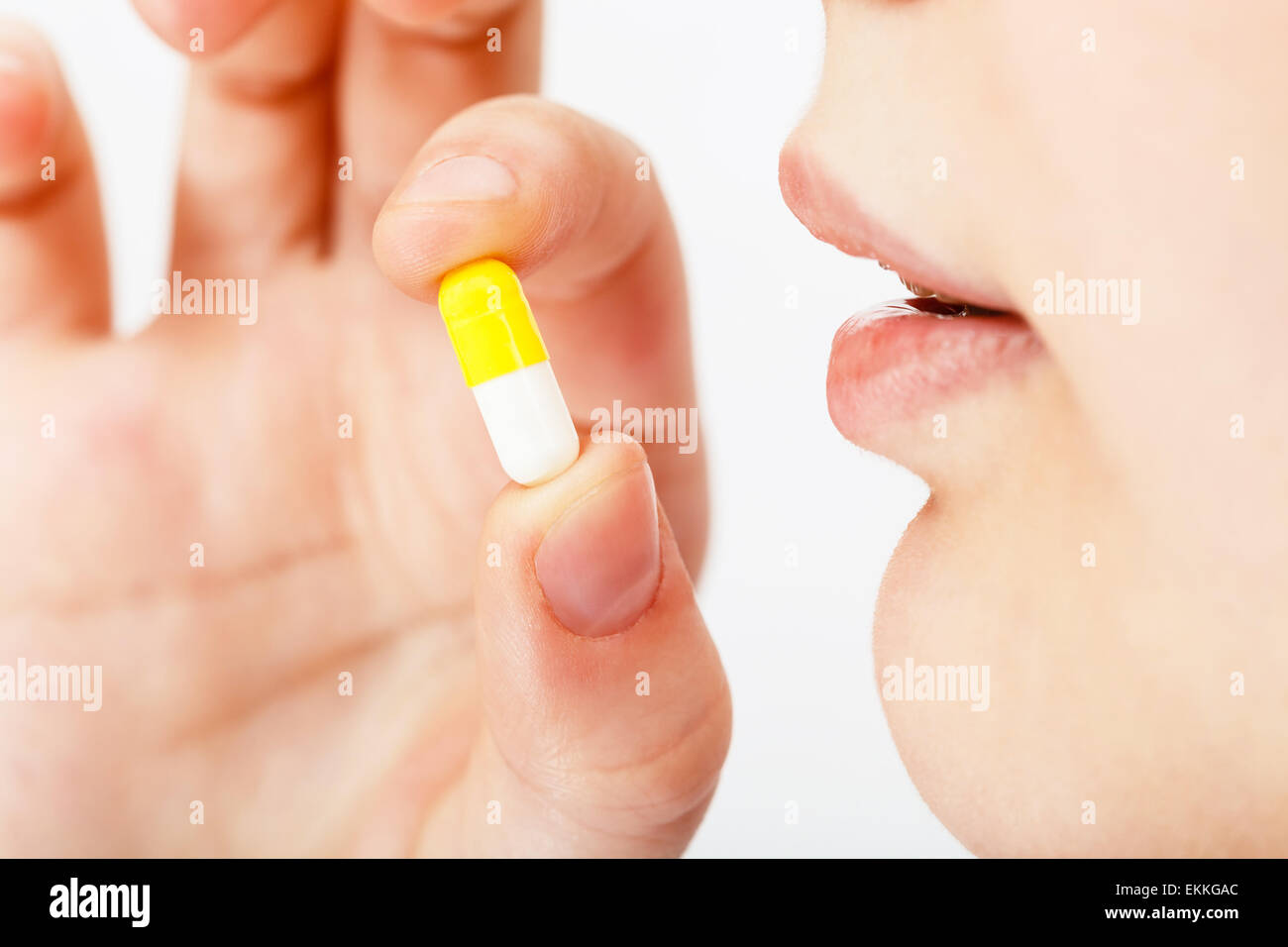 woman takes pill close up Stock Photo - Alamy
