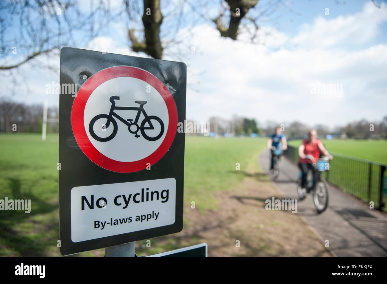 Cyclists ignore a no cycling road sign Stock Photo - Alamy