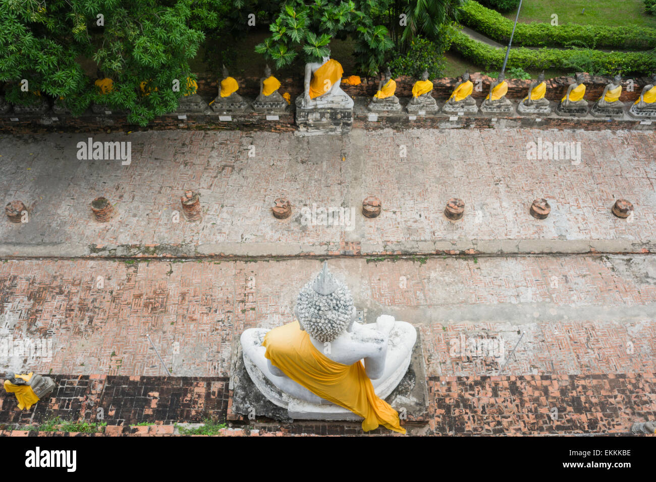 A row of Buddha statues across from the main Buddha statue Stock Photo ...