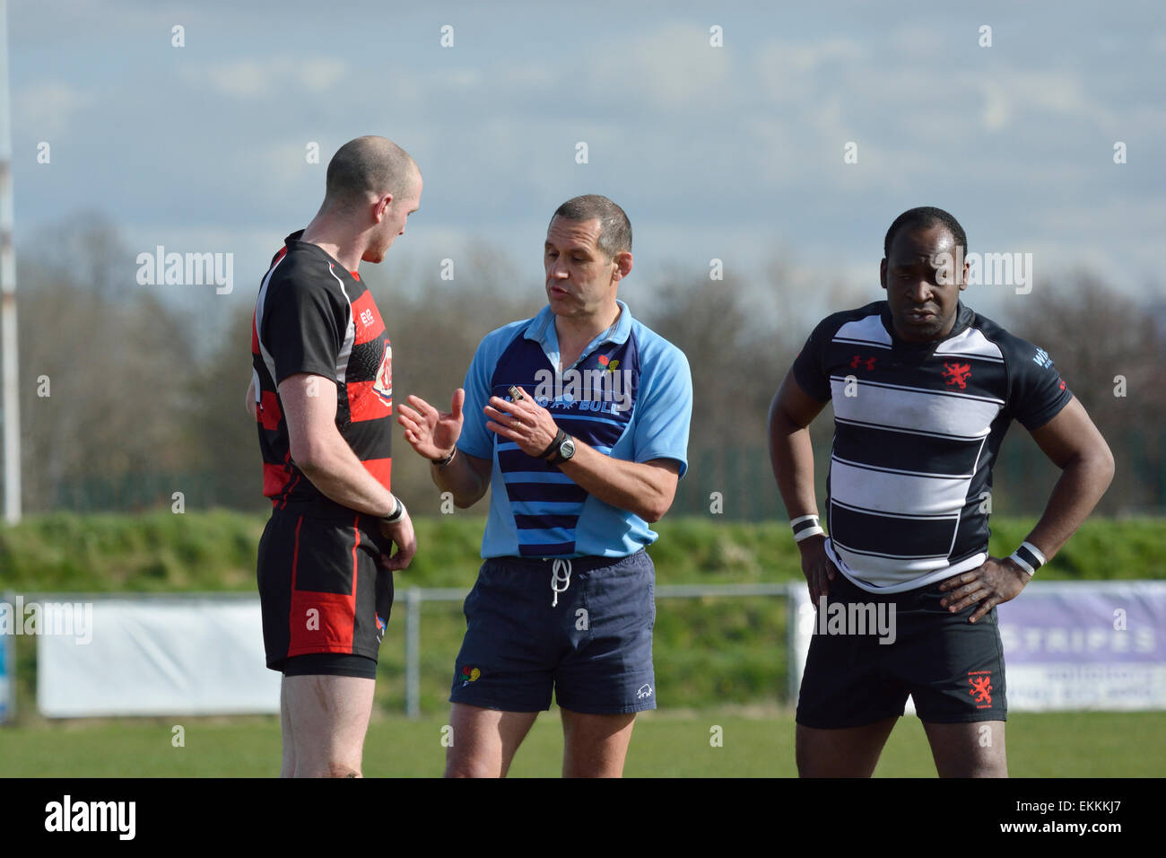 The referee speaks to the captains of opposing teams after a fight has ...