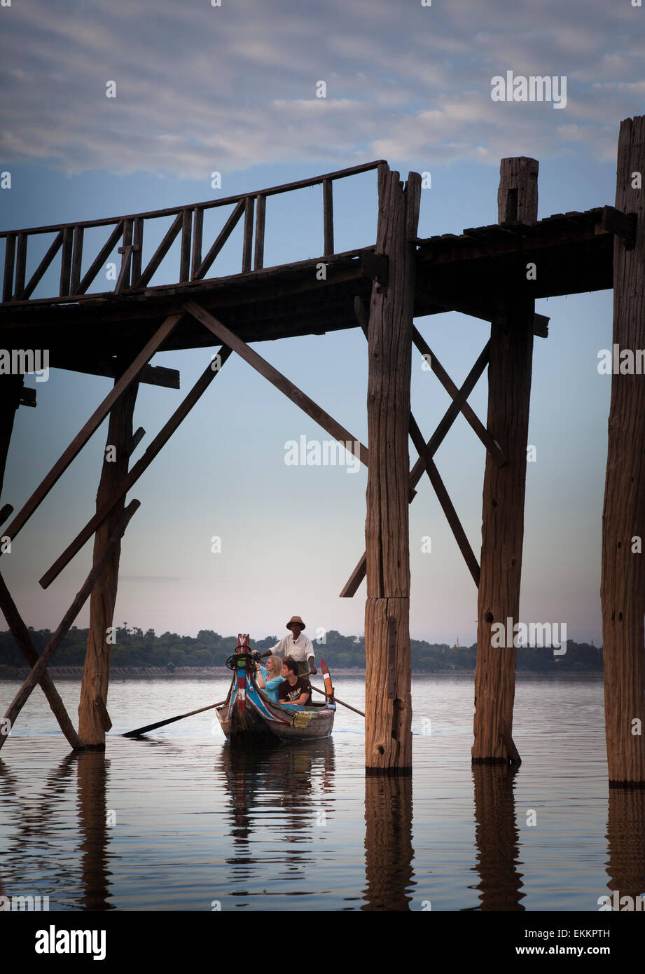 By Ubain Bridge, a Burmese boatman and his passengers, a blond western ...