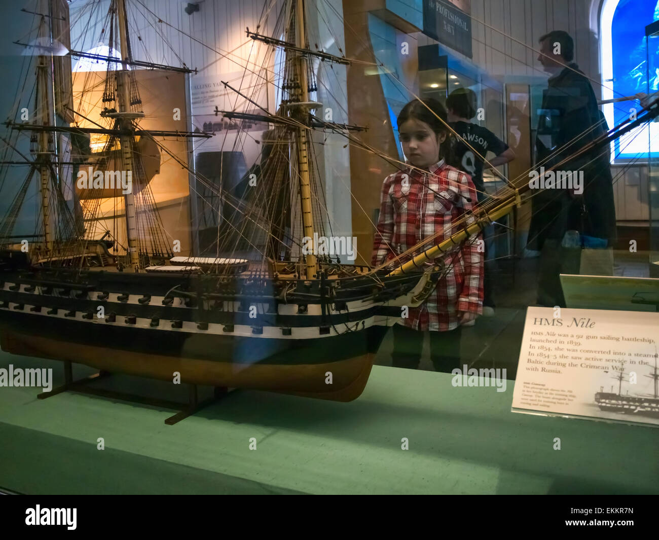 A young girl looking at a model of HMS Nile in the Royal Navy Museum ...