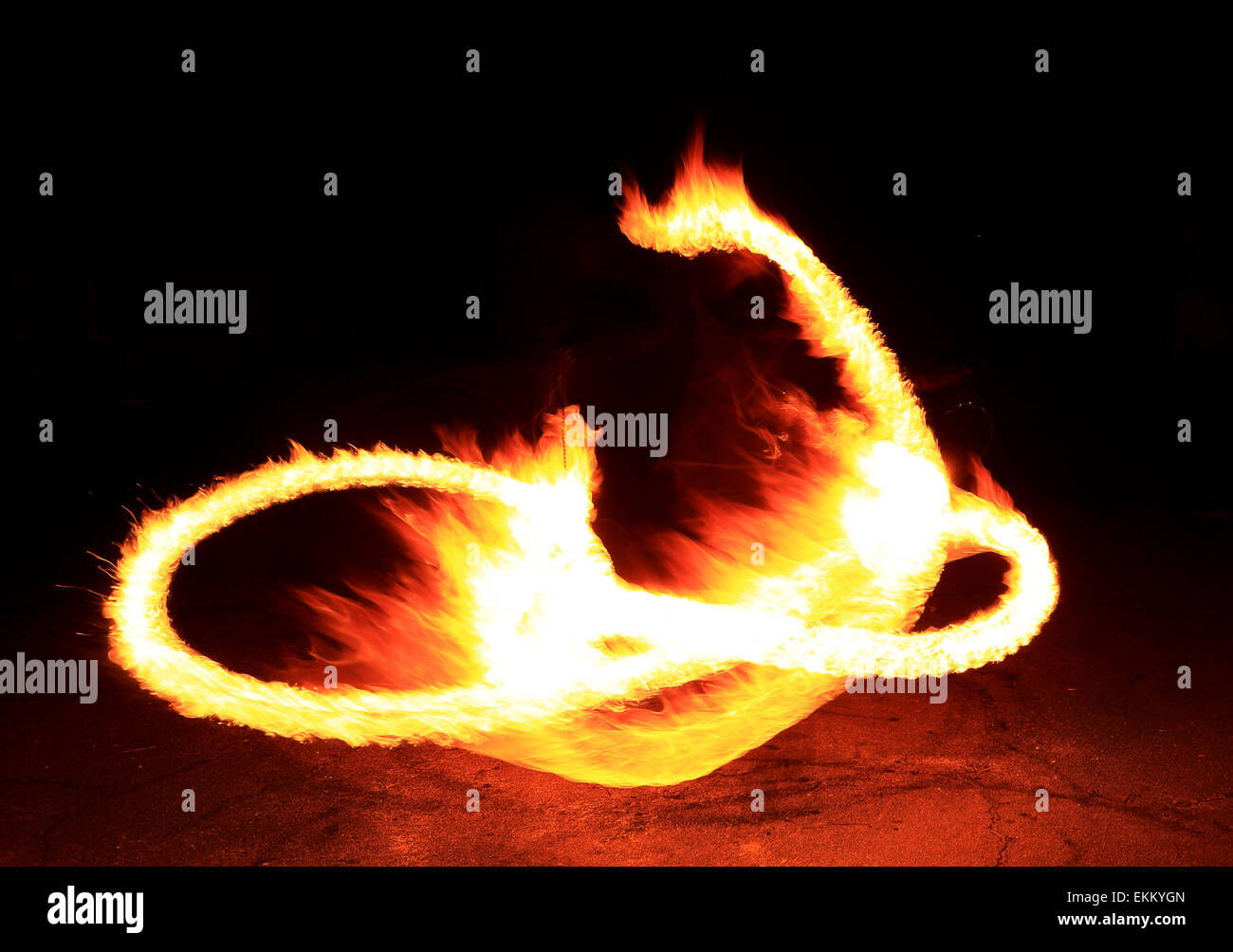 Fire show flaming trails, background Stock Photo - Alamy