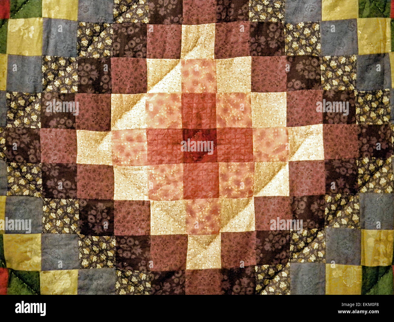 Close up of a brown calico handmade quilt Stock Photo - Alamy