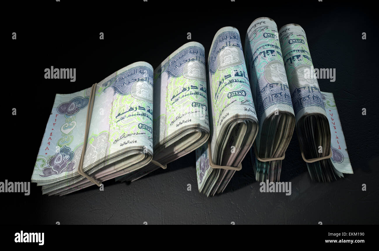 A close-up view of five wads of folded over stacks of dirham banknotes ...