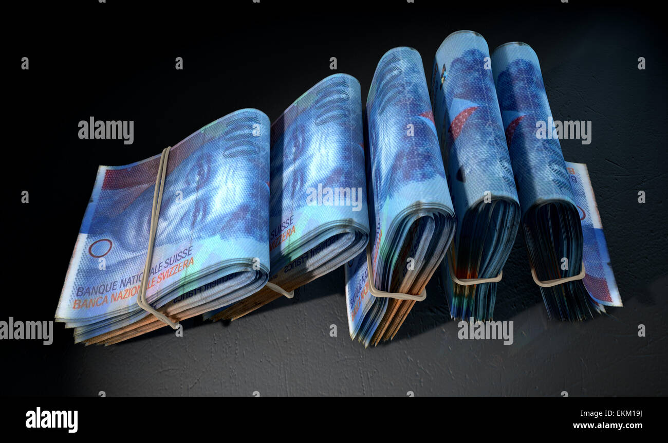 A close-up view of five wads of folded over stacks of swiss franc ...